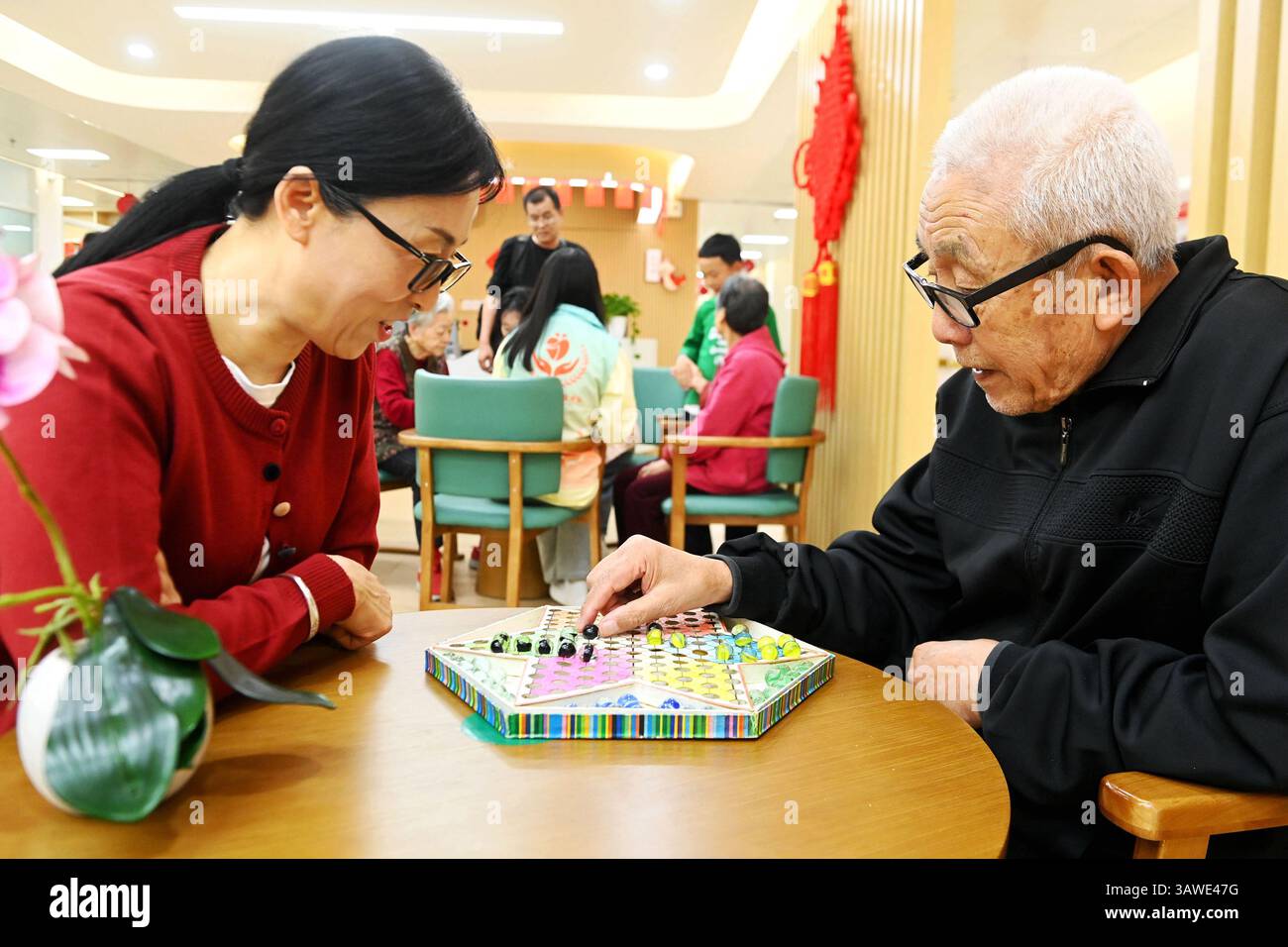 RIZHAO, CHINA - APRIL 19, 2025 - Elderly people are having fun in the ...
