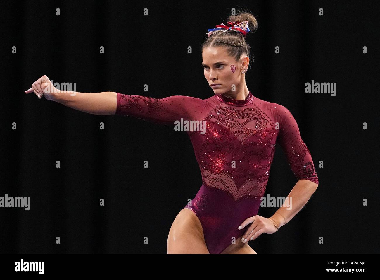 Oklahoma's Jordan Bowers competes on the balance beam during the NCAA ...