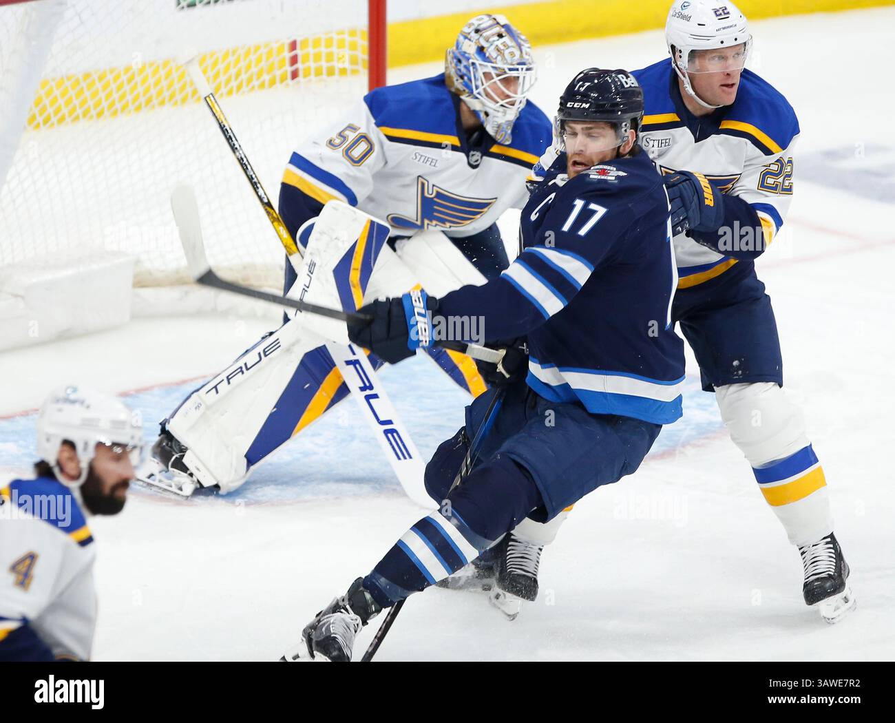 St. Louis Blues' Ryan Suter (22) defends against Winnipeg Jets' Adam ...