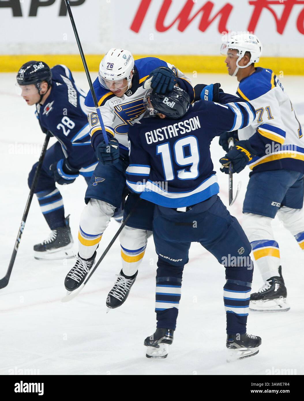 Winnipeg Jets' David Gustafsson (19) and St. Louis Blues' Zack Bolduc ...
