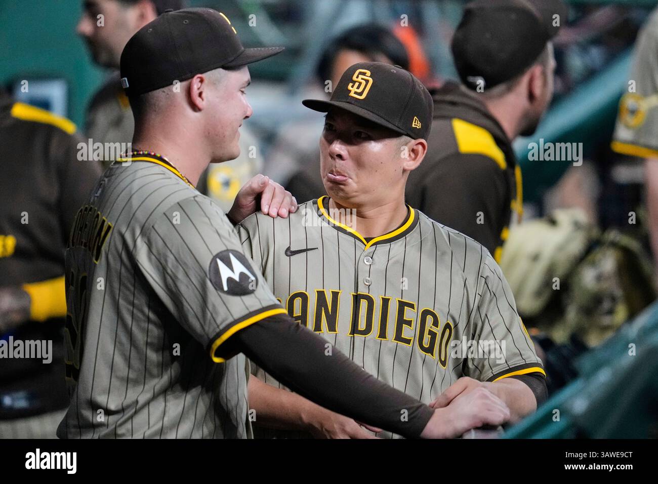 San Diego Padres relief pitcher Adrian Morejon, left, talks with relief ...