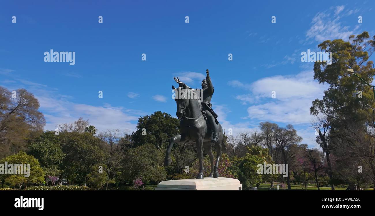Bronze equestrian statue of King Alfonso XII raising his arms in Maria ...