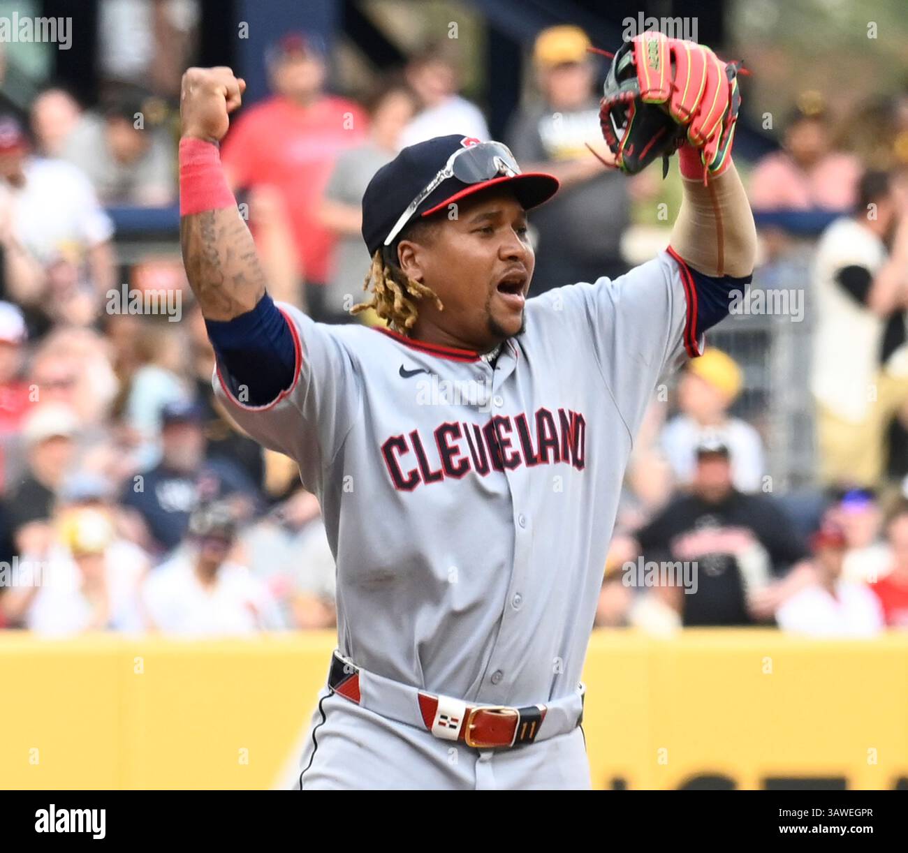 Cleveland Guardians third base José Ramírez (11) celebrates tagging out ...