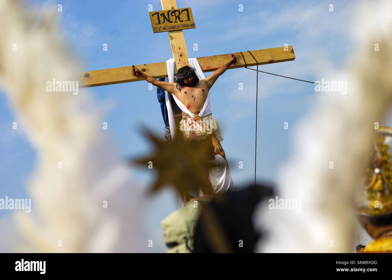 José Julio Olivares performing as Jesus Christ while he re-enacts the ...