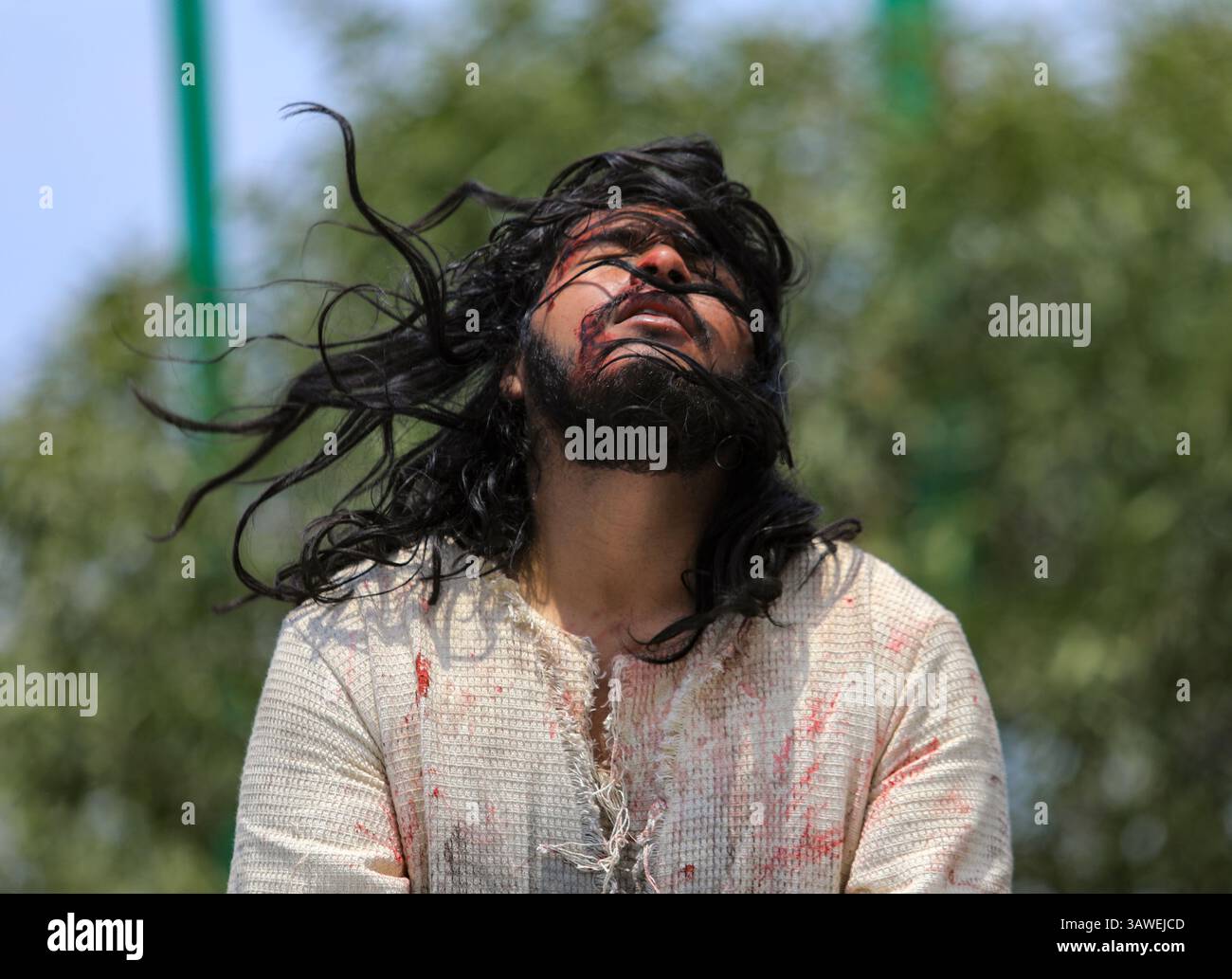 José Julio Olivares performing as Jesus Christ while he re-enacts the ...