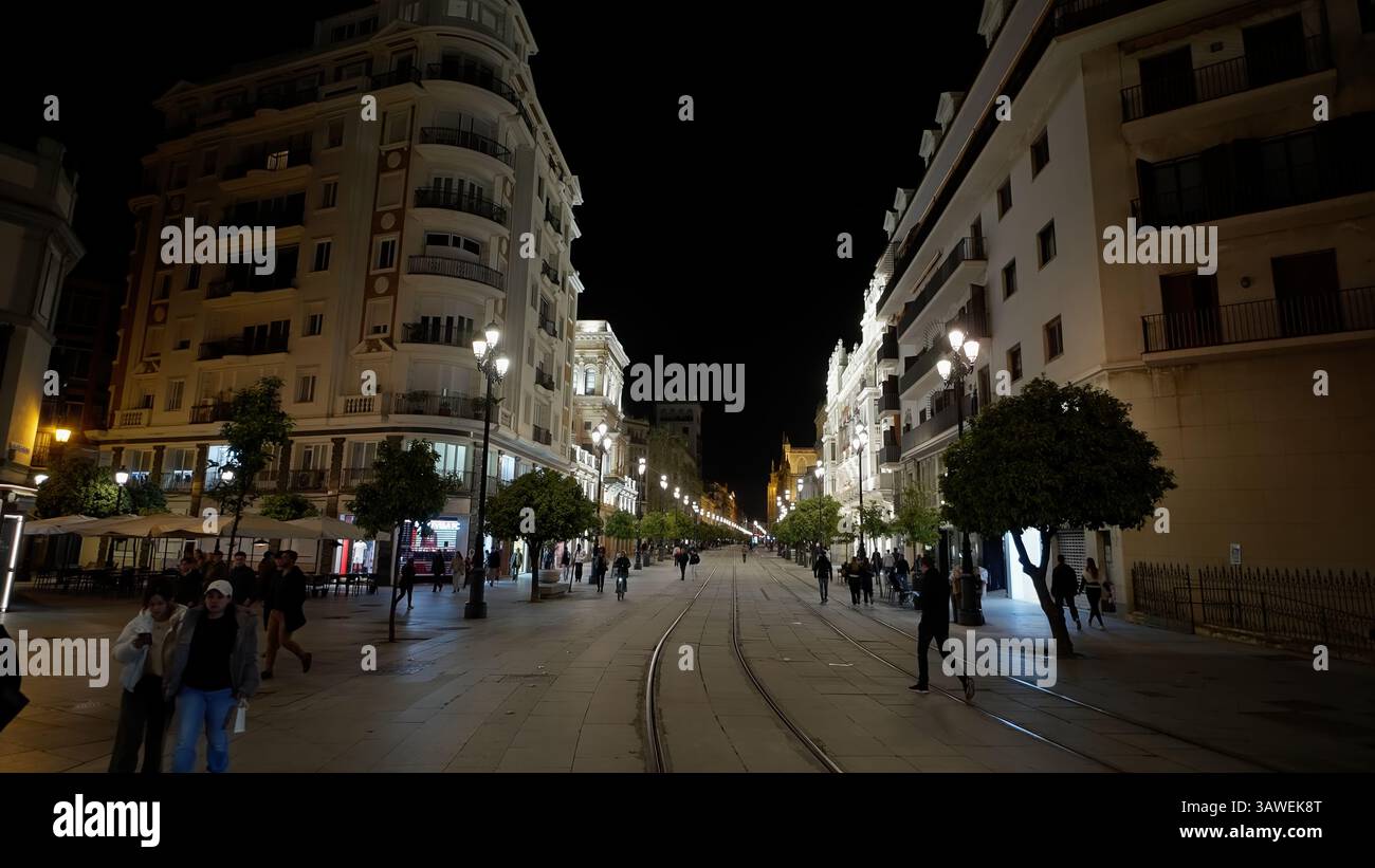 People enjoying evening walk along Avenida de la Constitucion in ...