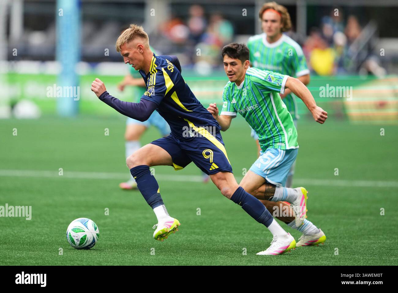 Nashville SC forward Sam Surridge (9) moves the ball against Seattle Sounders defender Kalani ...