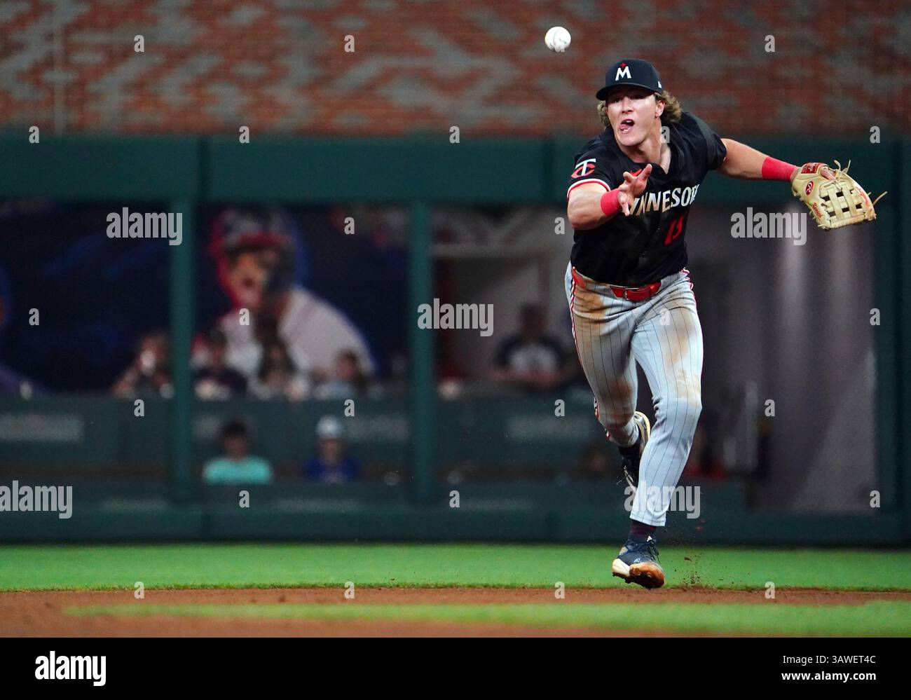 Minnesota Twins second baseman Luke Keaschall (15) tosses the ball to ...