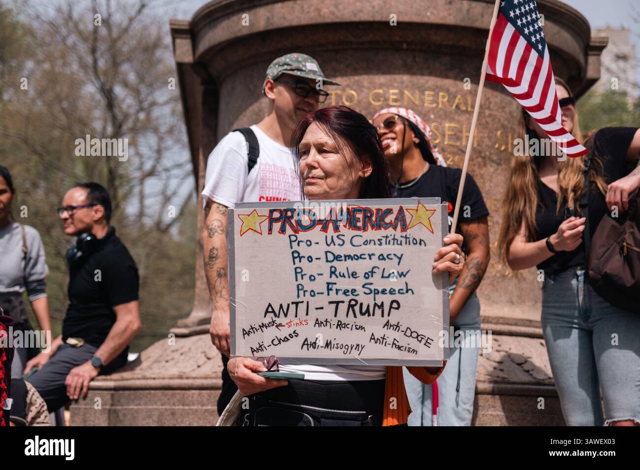 New York, United States. 19th Apr, 2025. A woman holds a "Pro -America ...