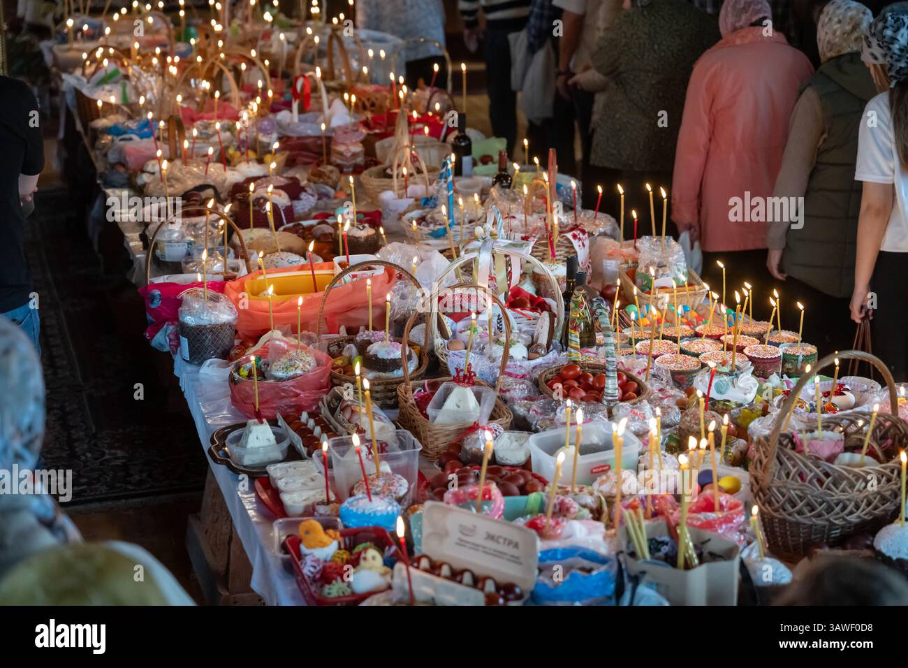 Easter cakes and eggs seen on a table in the church before the blessing ...