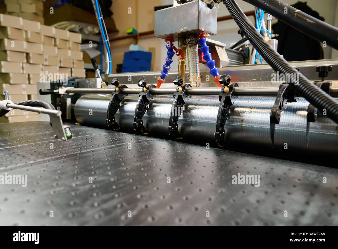 Precision rollers in action at a cardboard box manufacturing plant ...