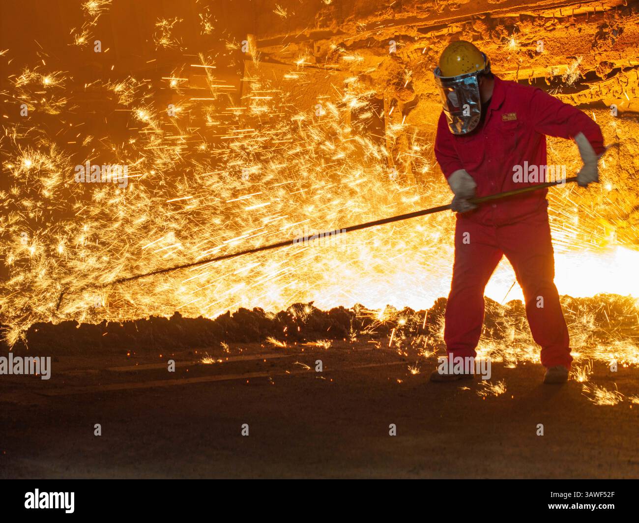 A worker labors on a furnace at a steelmaker in Huai'an in east China's ...