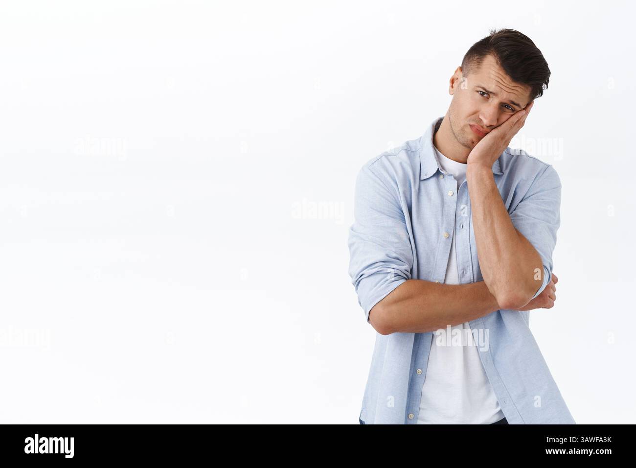 Portrait of reluctant and tired caucasian guy, lean on palm and ...