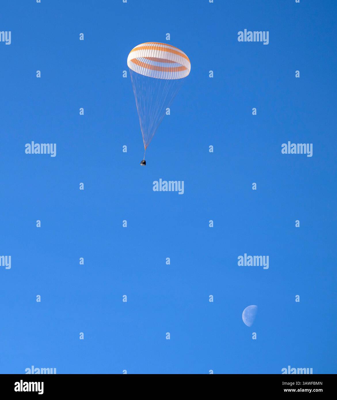 The Soyuz MS-26 spacecraft is seen as it lands in a remote area near ...