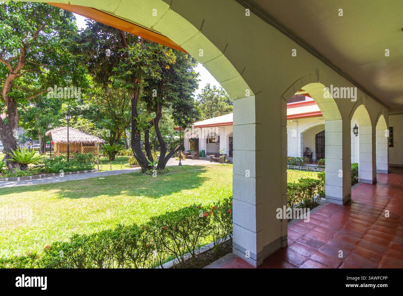 Arcaded hall overlooking a garden at the Rizal House Museum in Calamba ...