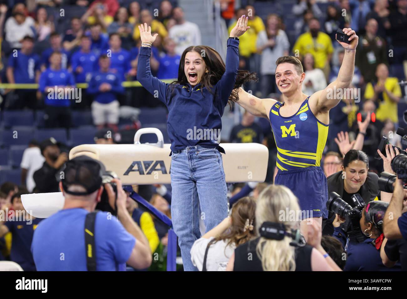 ANN ARBOR, MI - APRIL 19: Michigan gymnast Paul Juda, right, laughs as ...