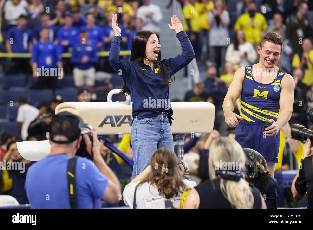 ANN ARBOR, MI - APRIL 19: Michigan gymnast Paul Juda, right, laughs as ...
