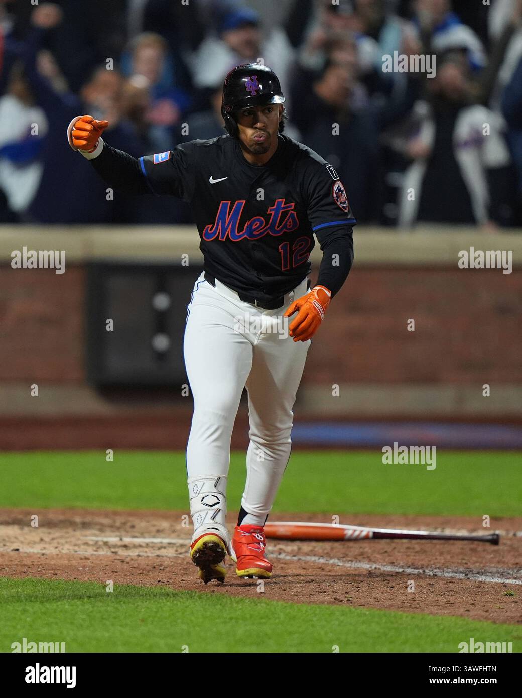 New York Mets' Francisco Lindor (12) celebrates after hitting a walk ...