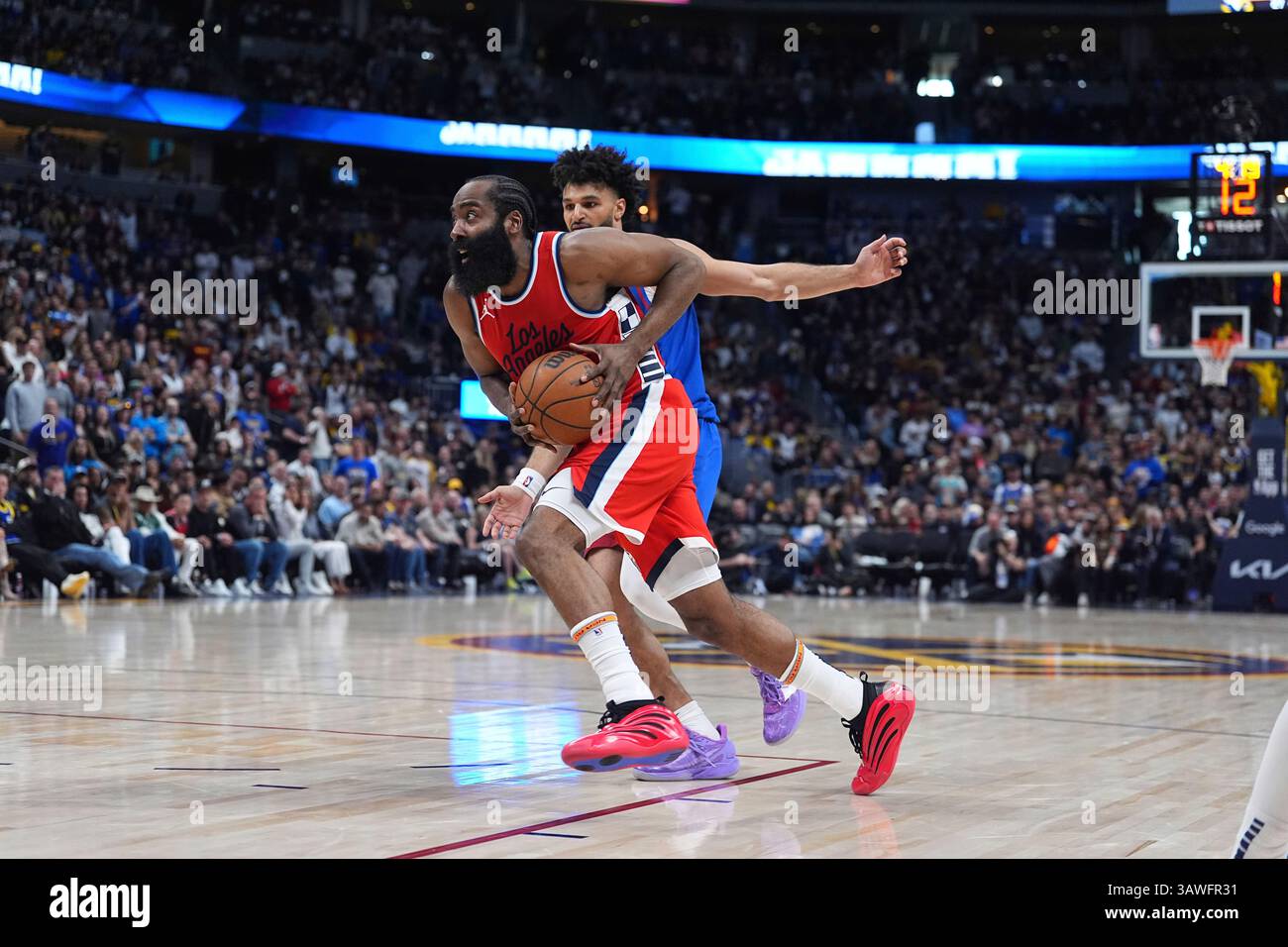 Los Angeles Clippers guard James Harden (1) drives past Denver Nuggets ...