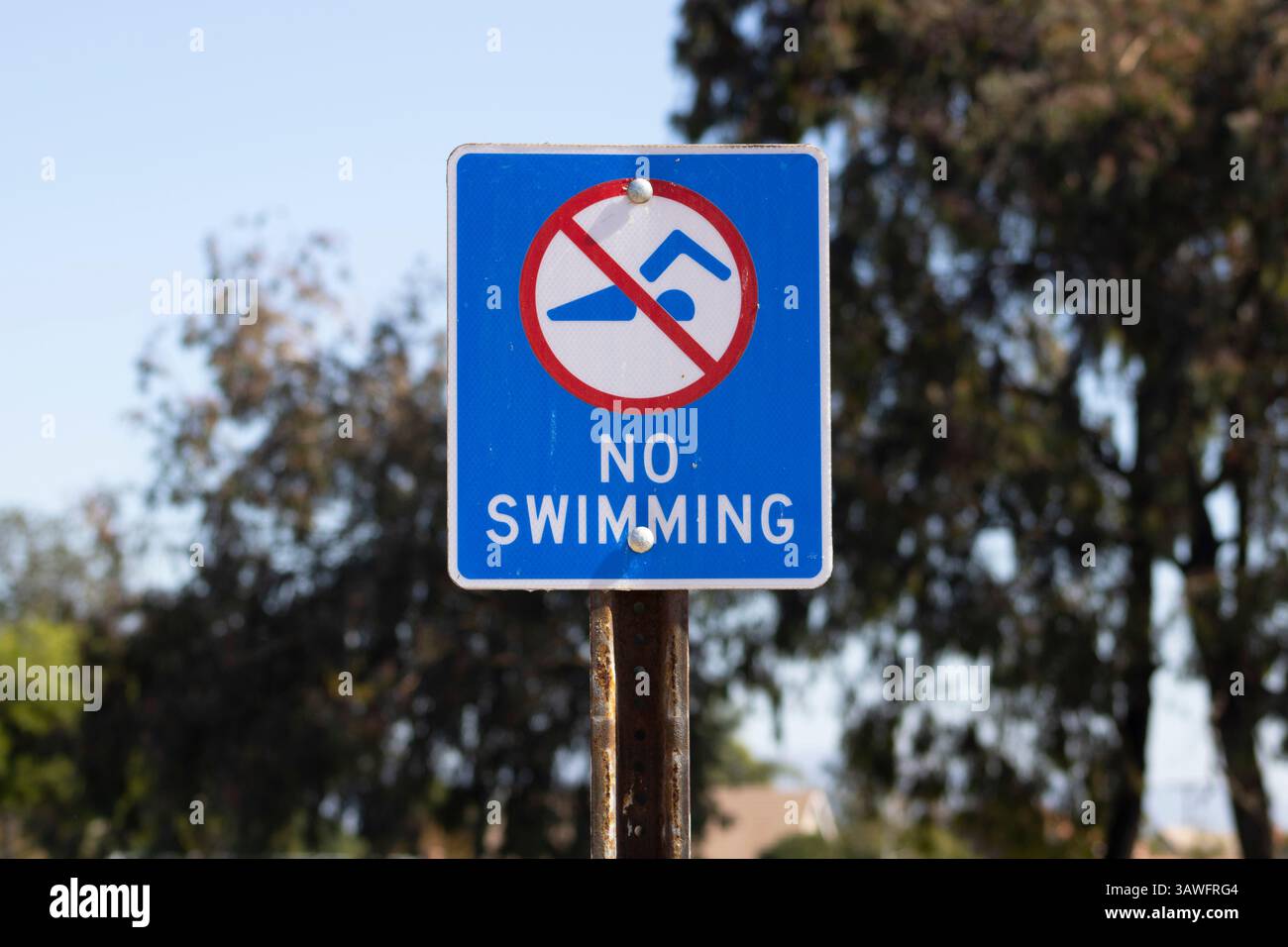no swimming sign in blue and red Stock Photo - Alamy