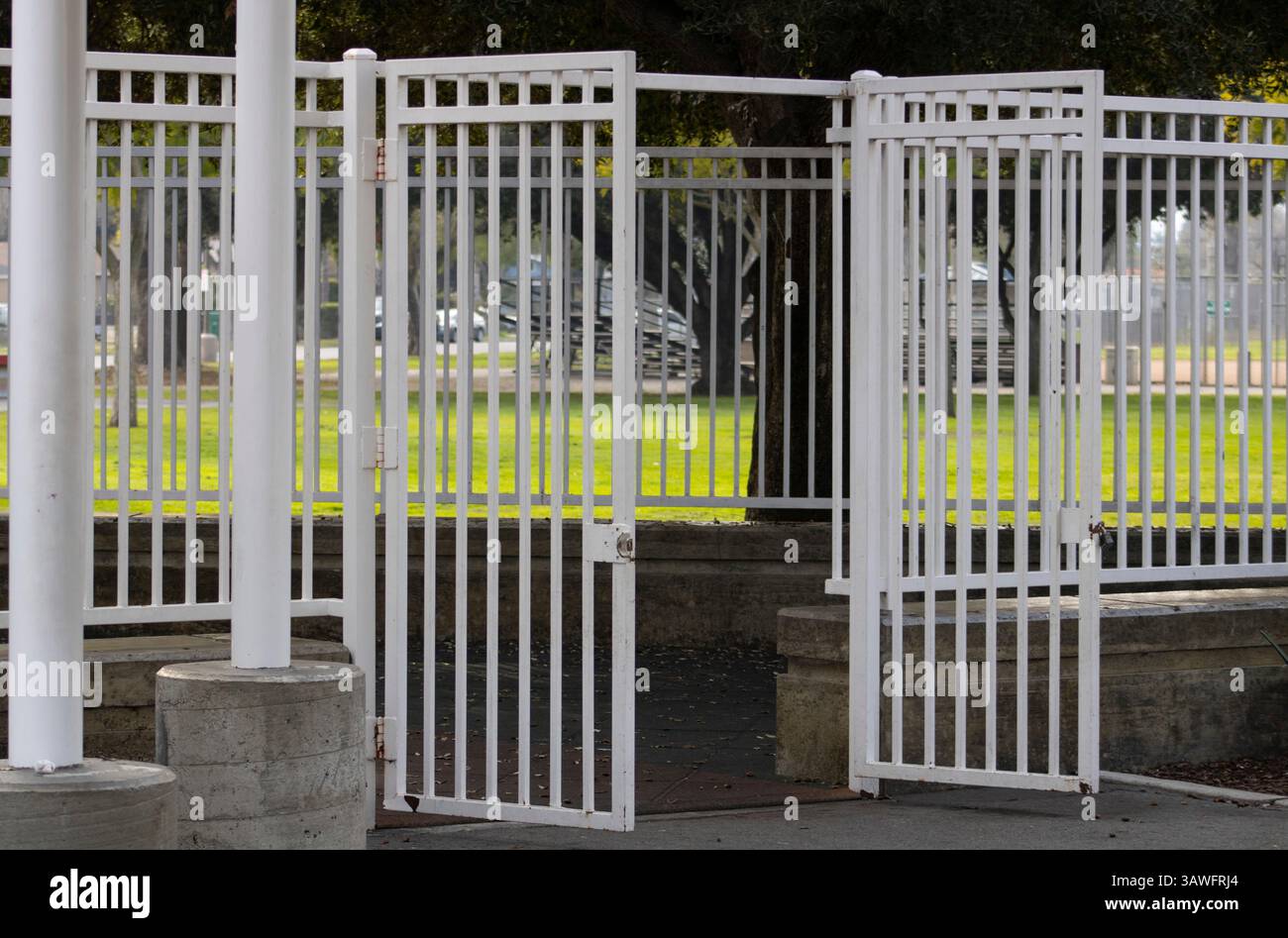 white metal gate with open door Stock Photo - Alamy