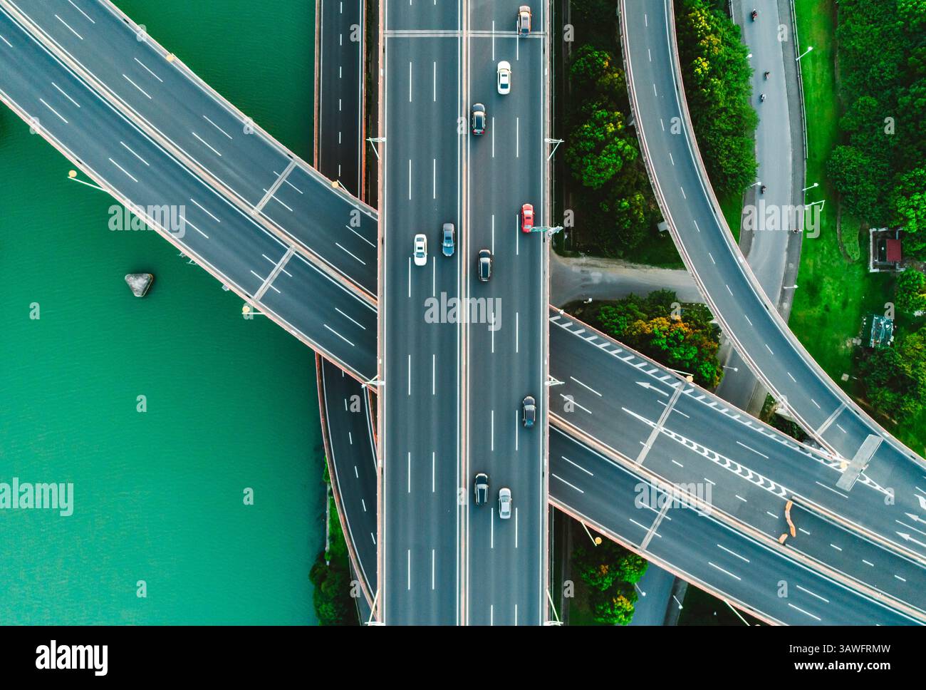 Aerial of vehicles navigate a complex highway system, showcasing ...