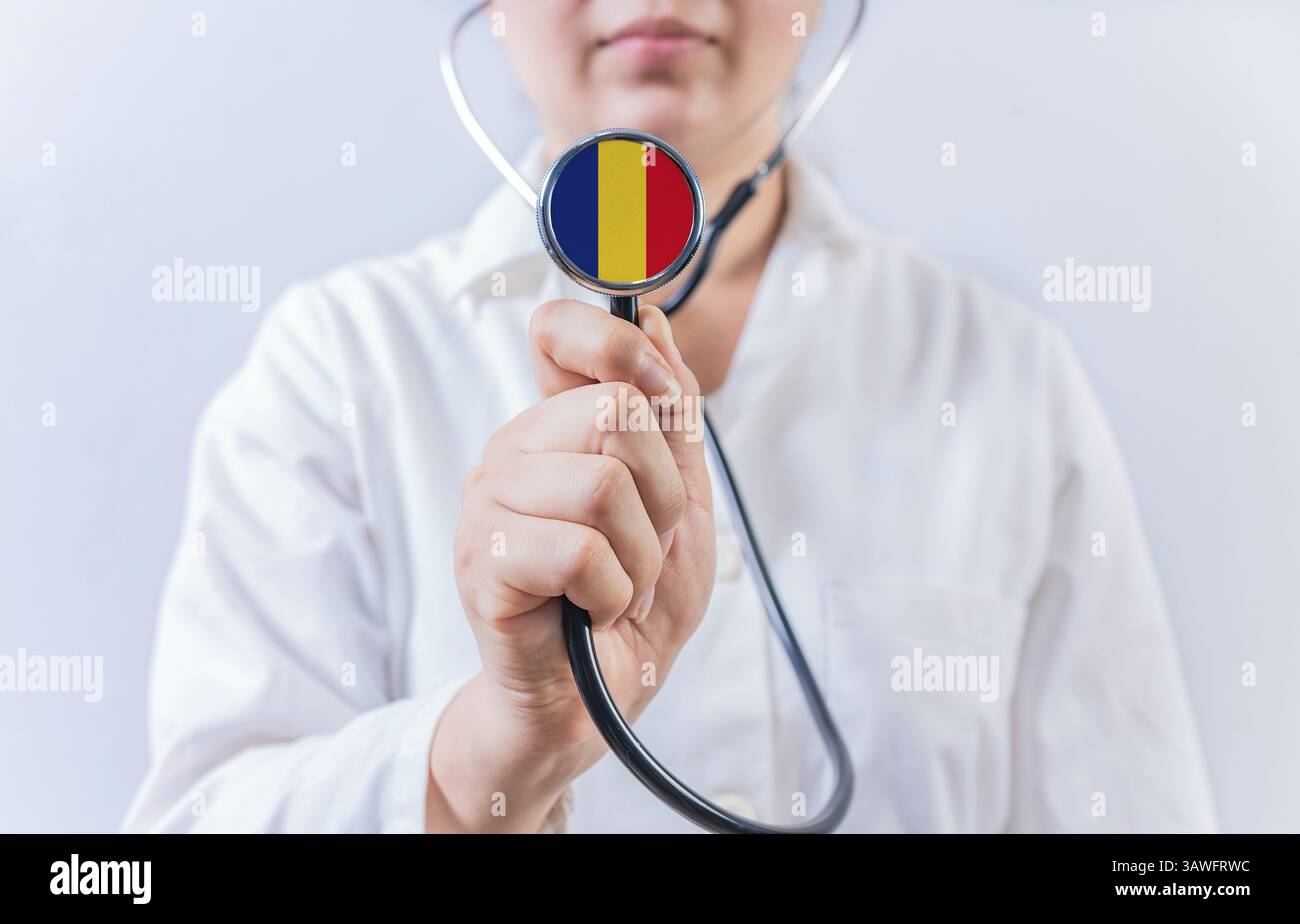 Female doctor holding stethoscope with Romanian flag. National health ...