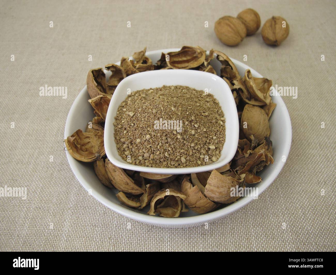 Brown granules of walnut shells, ground nutshells Stock Photo - Alamy