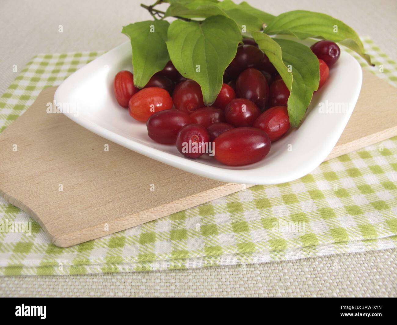 Ripe raw cornelian cherries Stock Photo - Alamy
