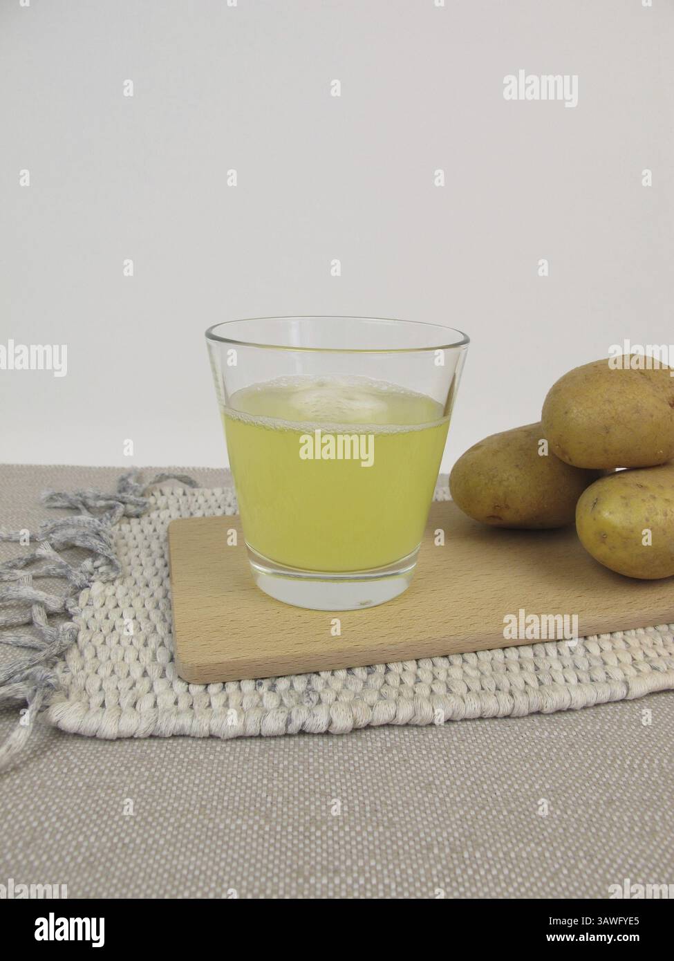 Raw potato juice Stock Photo - Alamy