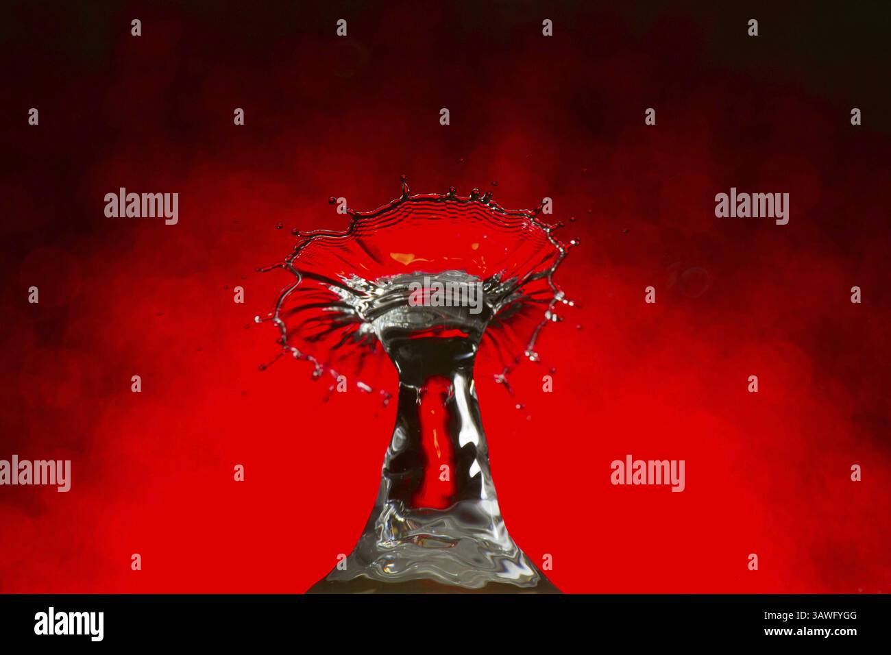 Abstract water splash in red Stock Photo - Alamy