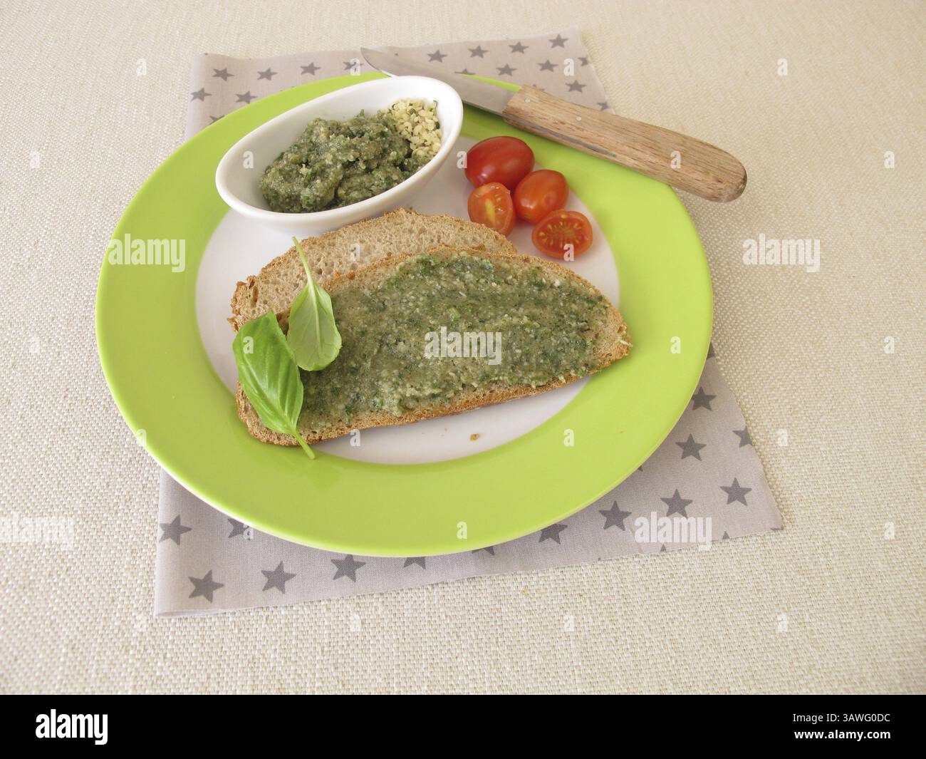 Homemade vegan hemp paste with basil on a slice of bread Stock Photo ...