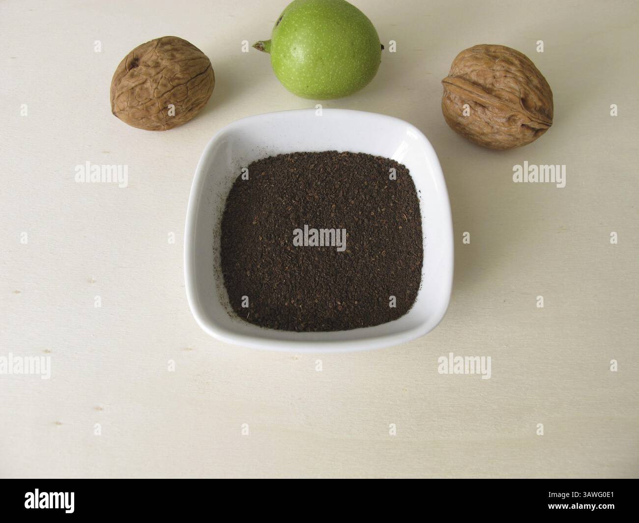 Colouring powder made from dried green walnut shells Stock Photo - Alamy