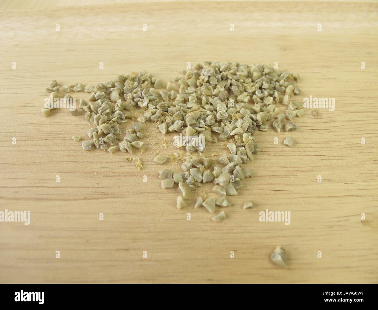 Coarsely ground green coffee beans Stock Photo - Alamy