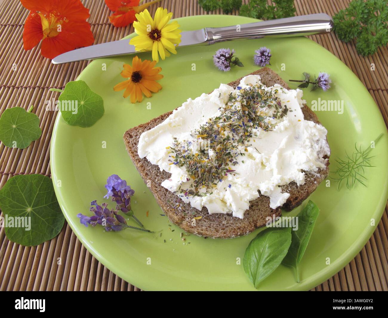Bread with spice blossom herb quark Stock Photo - Alamy