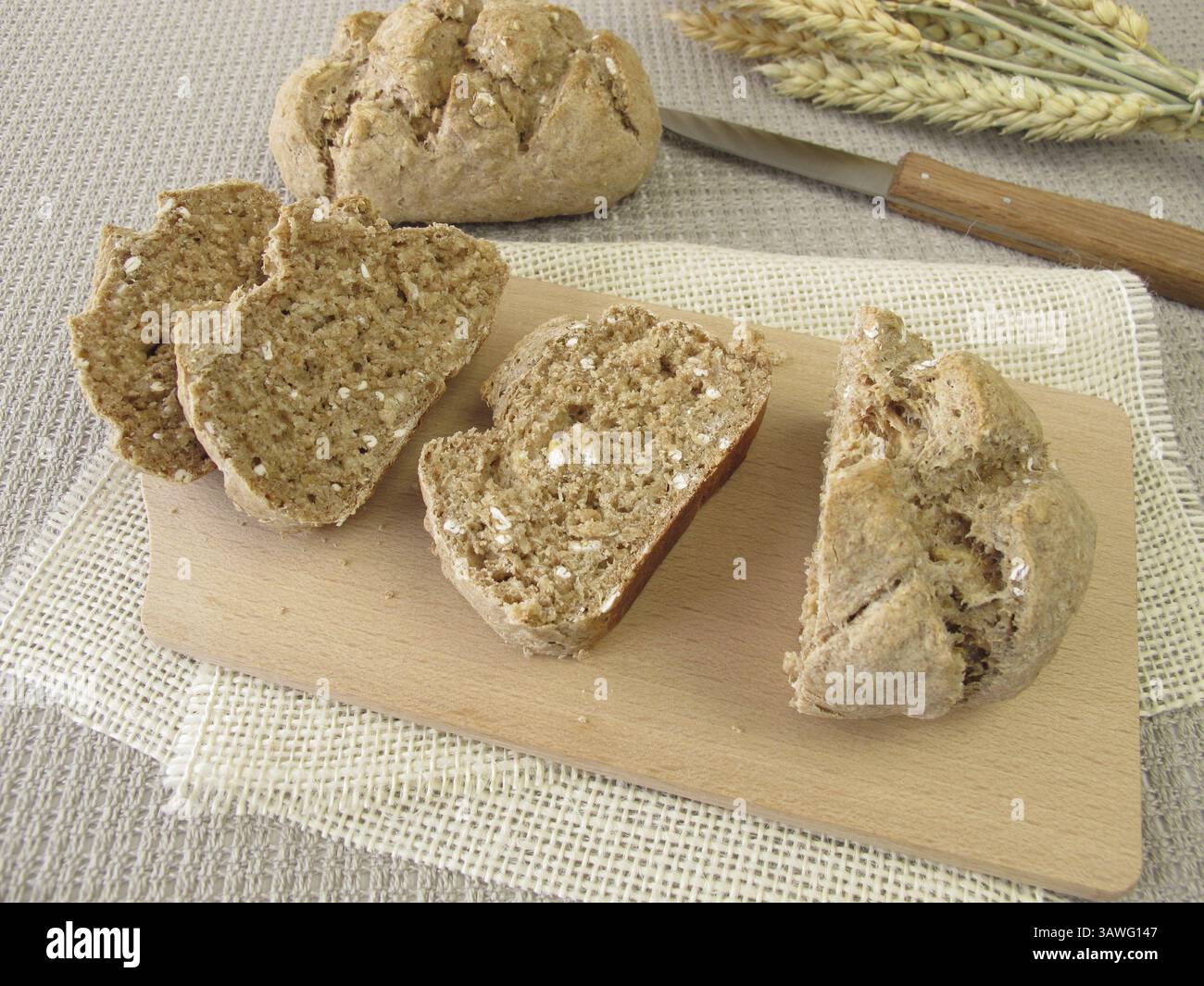 Sliced wholemeal bread rolls Stock Photo - Alamy