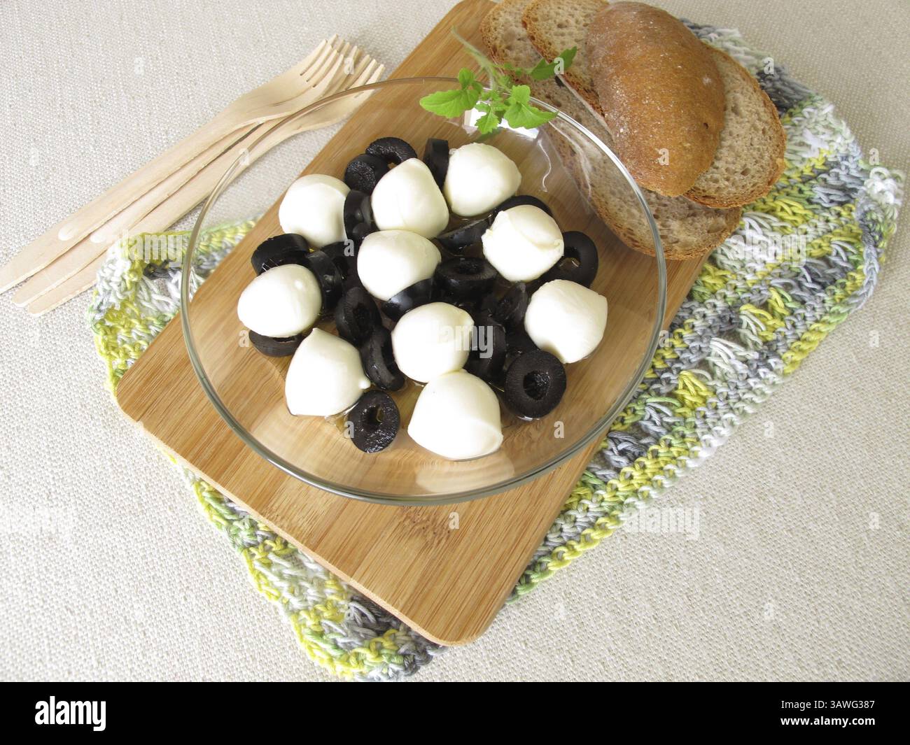 Antipasto with black olives and mozzarella balls in olive oil Stock ...