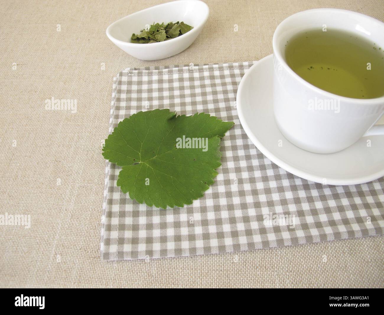 Mulberry leaf tea made from dried white mulberry leaves Stock Photo - Alamy