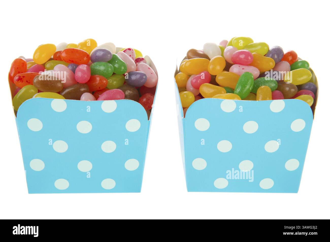 Two blue dotted cartons full with colourful candy Stock Photo - Alamy