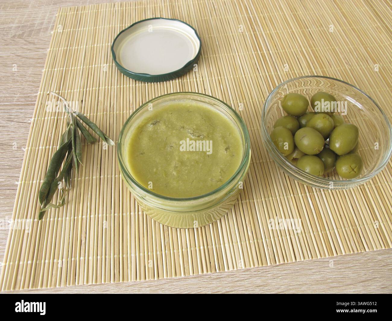 Green olive jam in a jar Stock Photo - Alamy