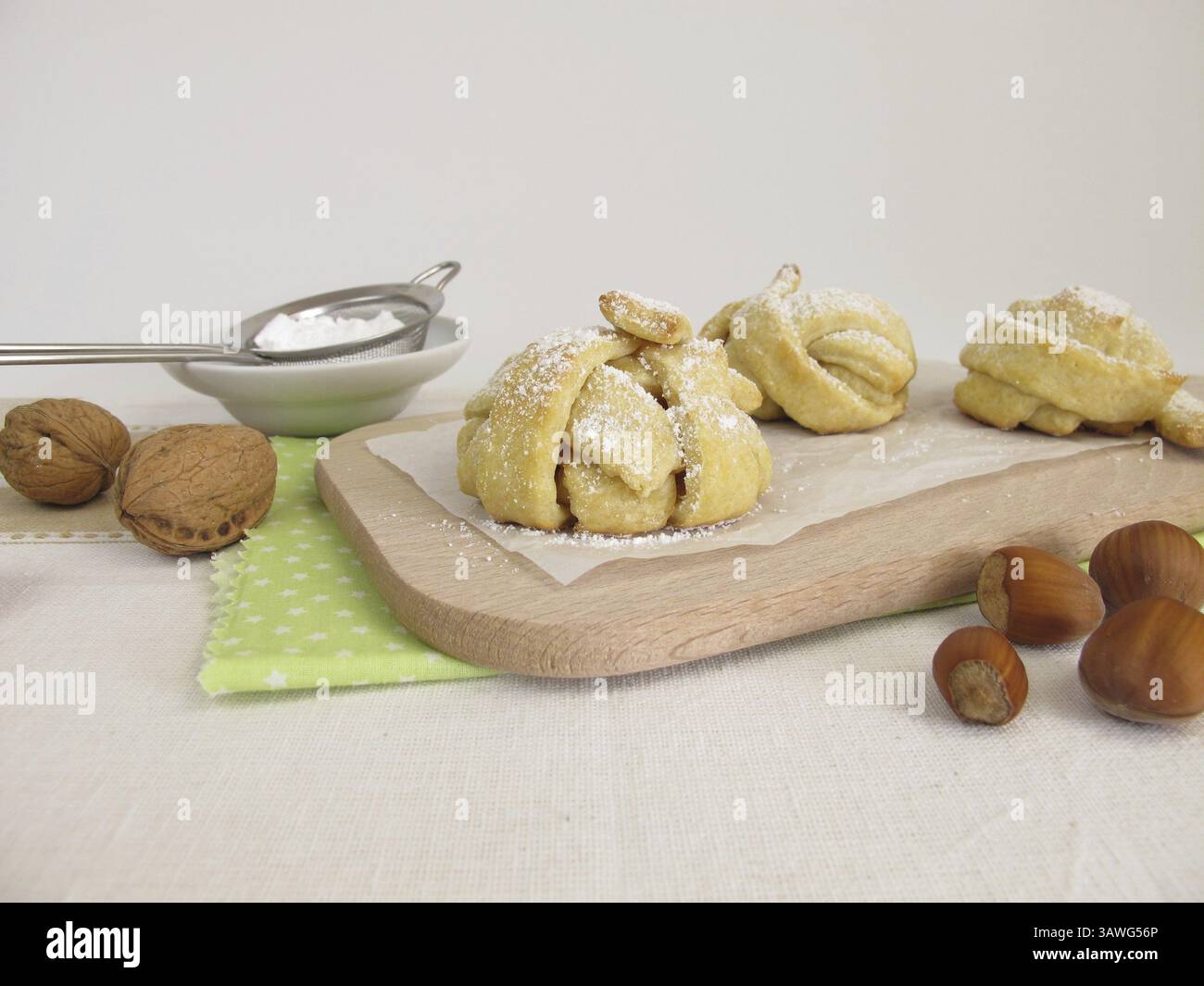 Baked snowballs made from shortcrust pastry with icing sugar Stock ...