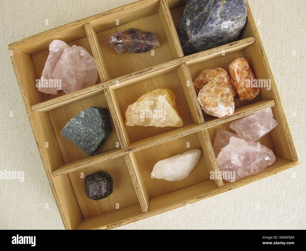 Healing stones in a wooden box Stock Photo - Alamy