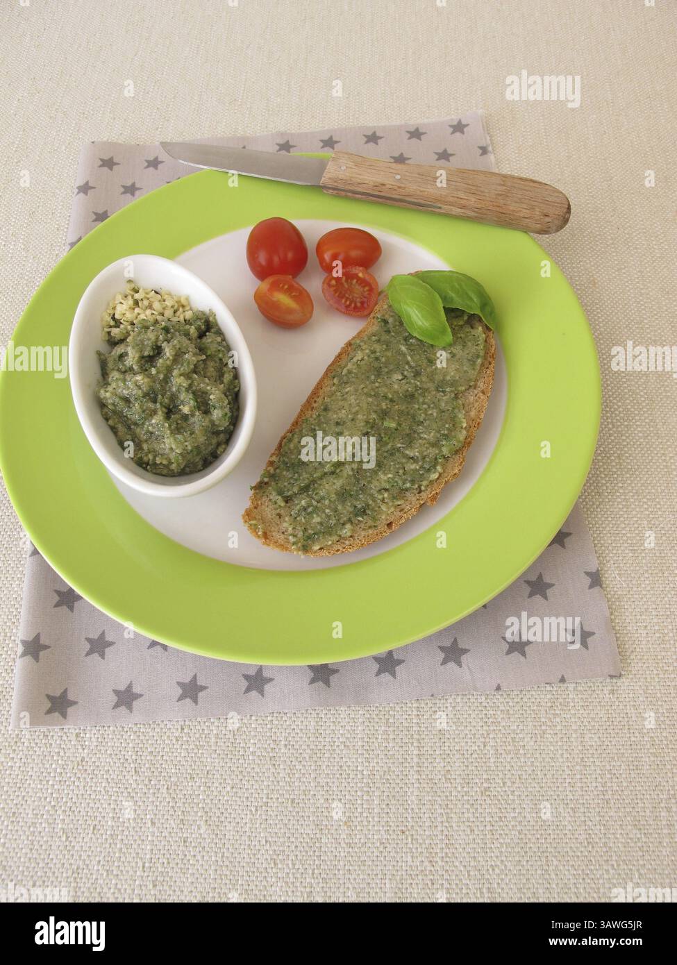 Homemade vegan hemp paste with basil on a slice of bread Stock Photo ...