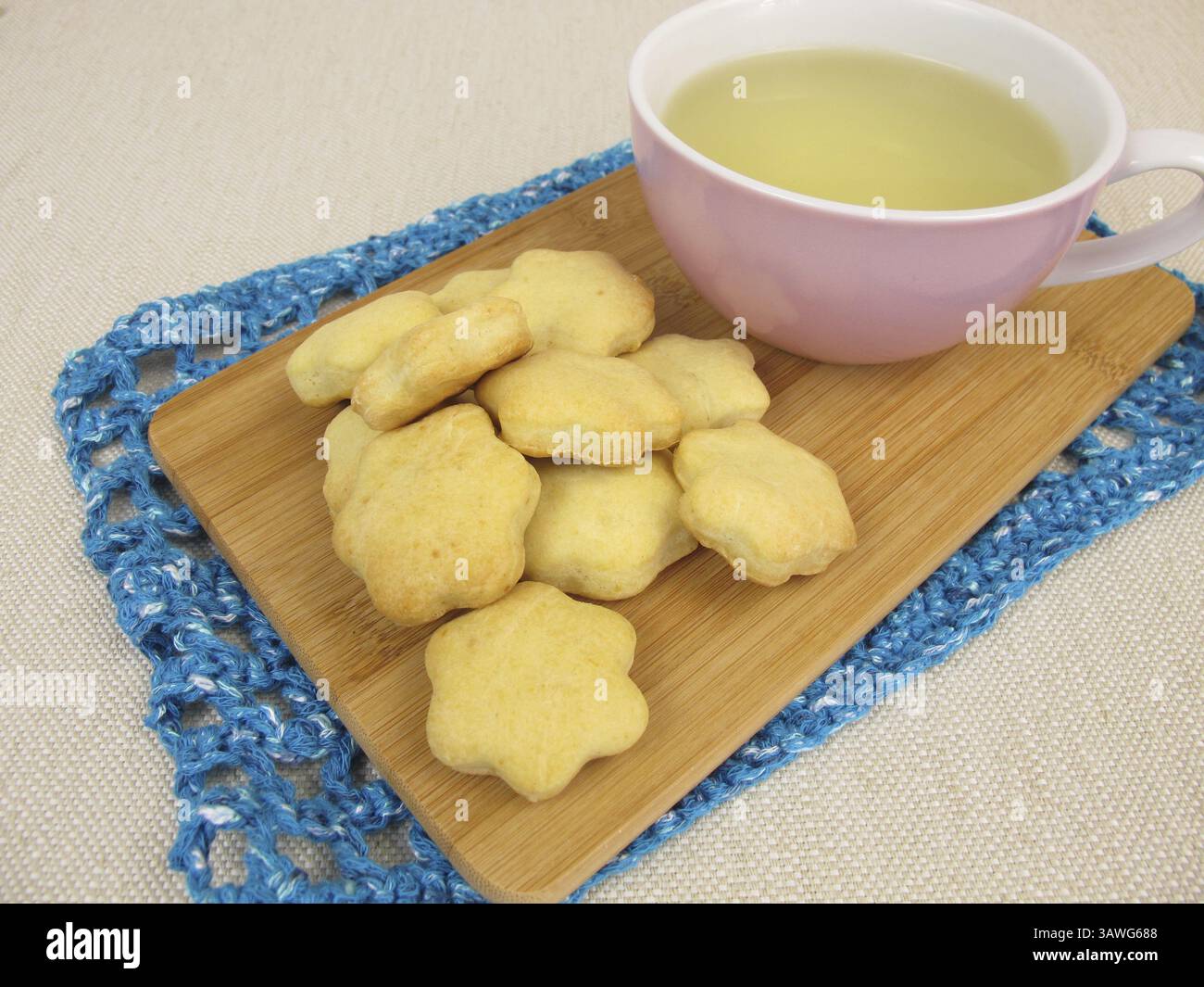 Tea and flower biscuits Stock Photo - Alamy