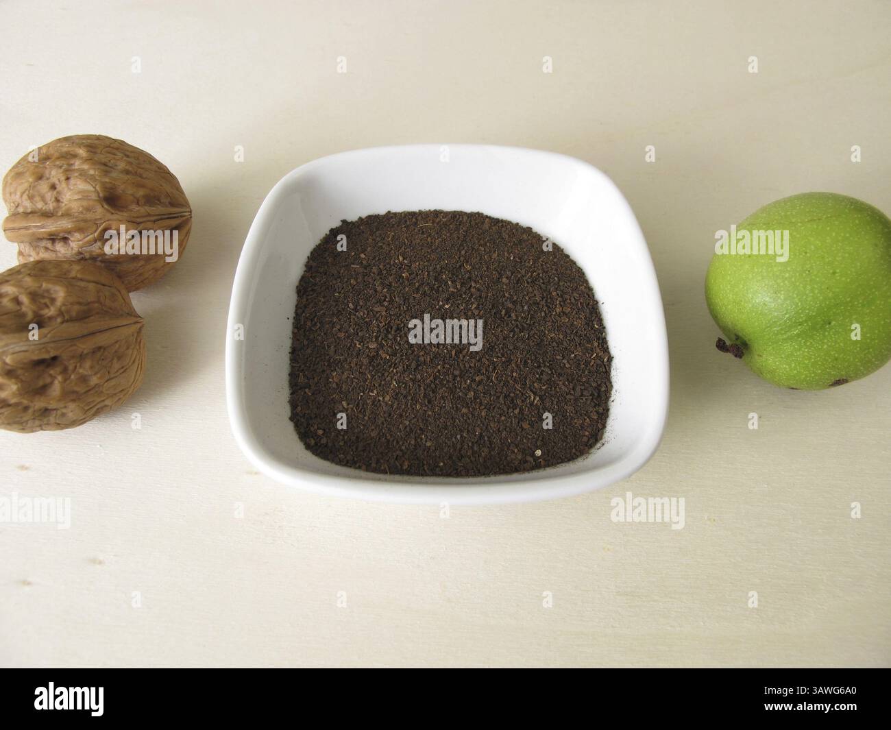 Colouring powder made from dried green walnut shells Stock Photo - Alamy