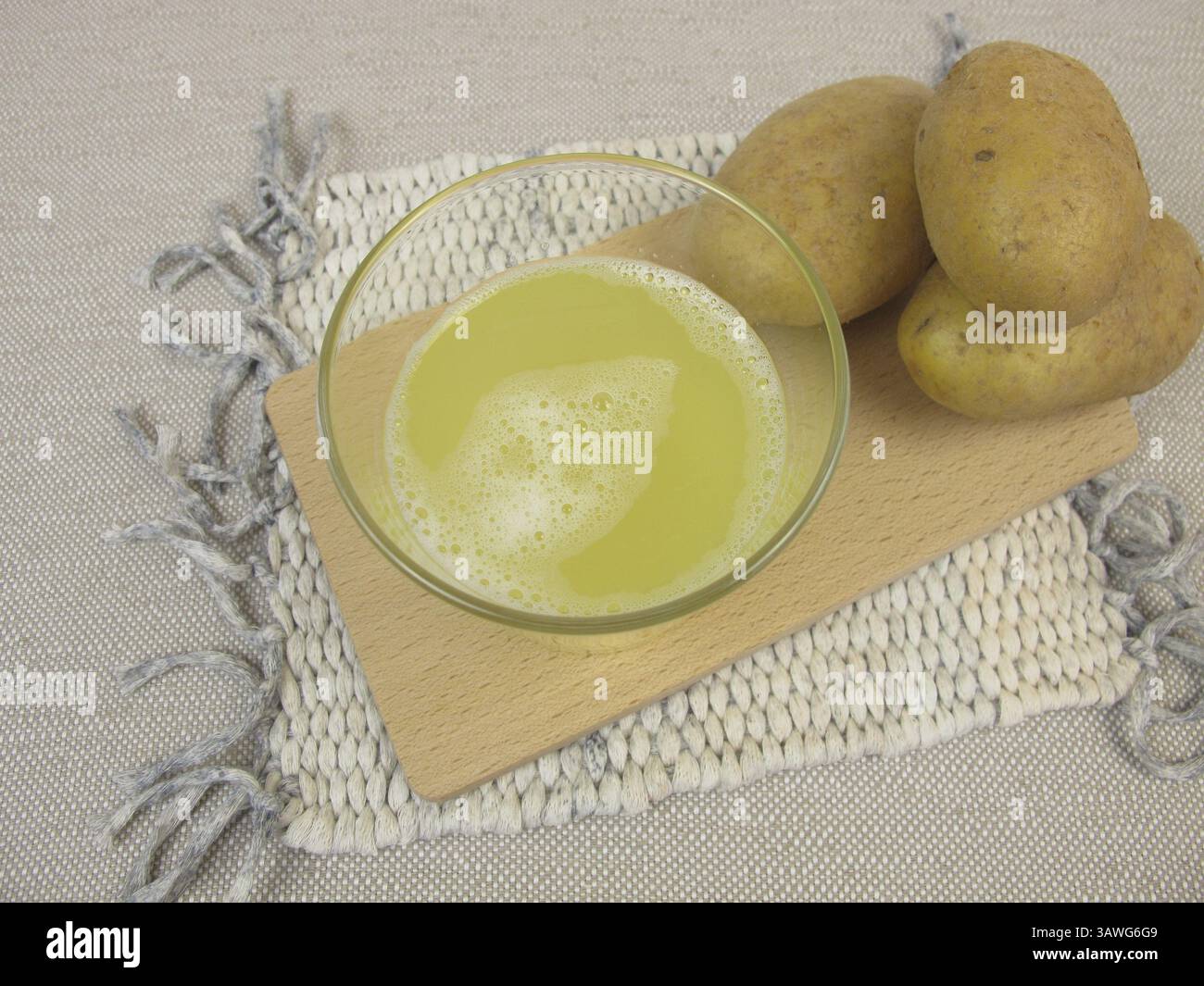 Raw potato juice Stock Photo - Alamy