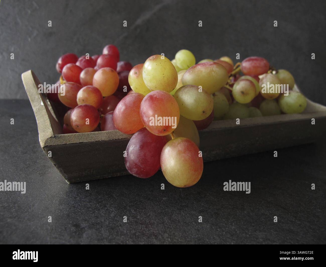 Still life with red grapes Stock Photo - Alamy