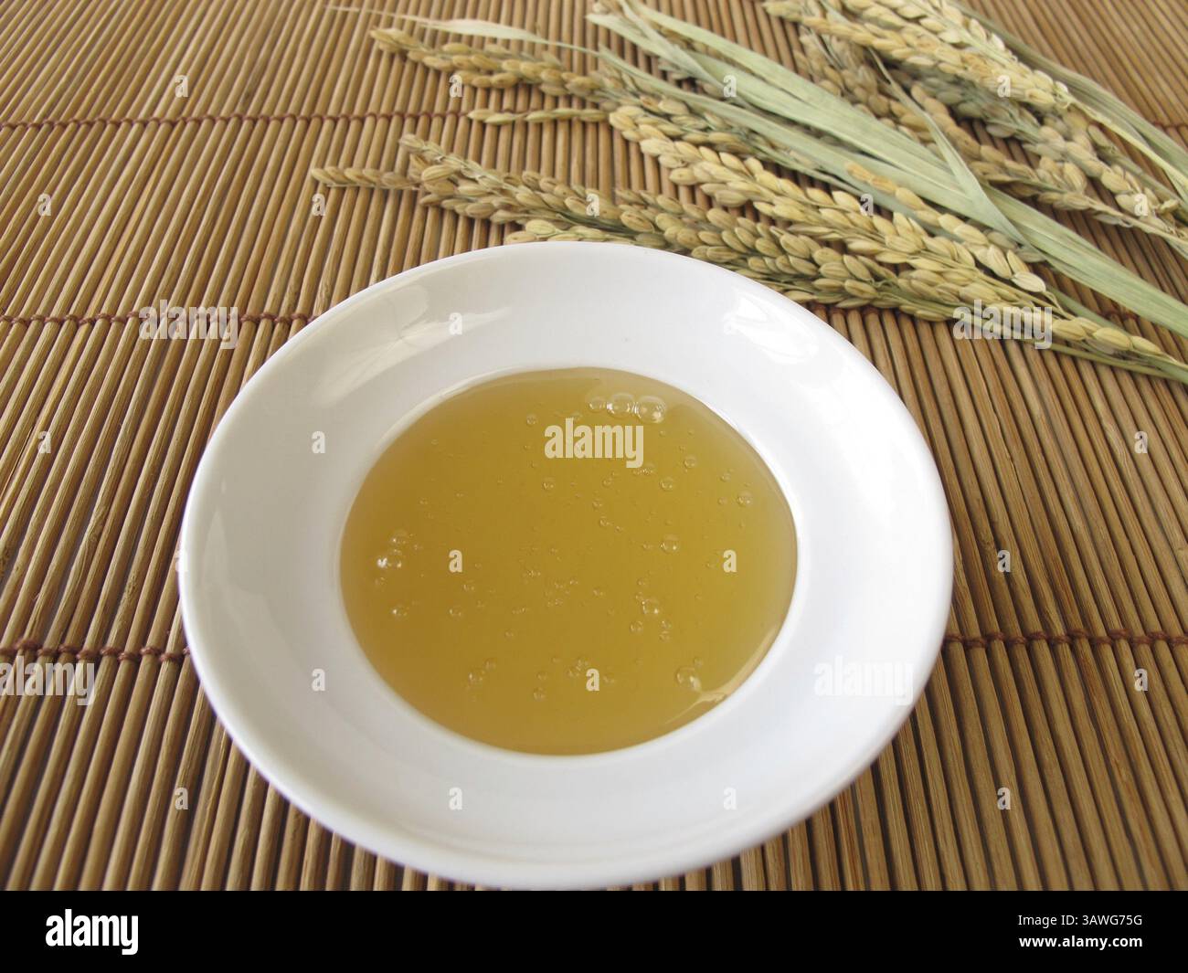 Rice syrup and rice panicles Stock Photo - Alamy