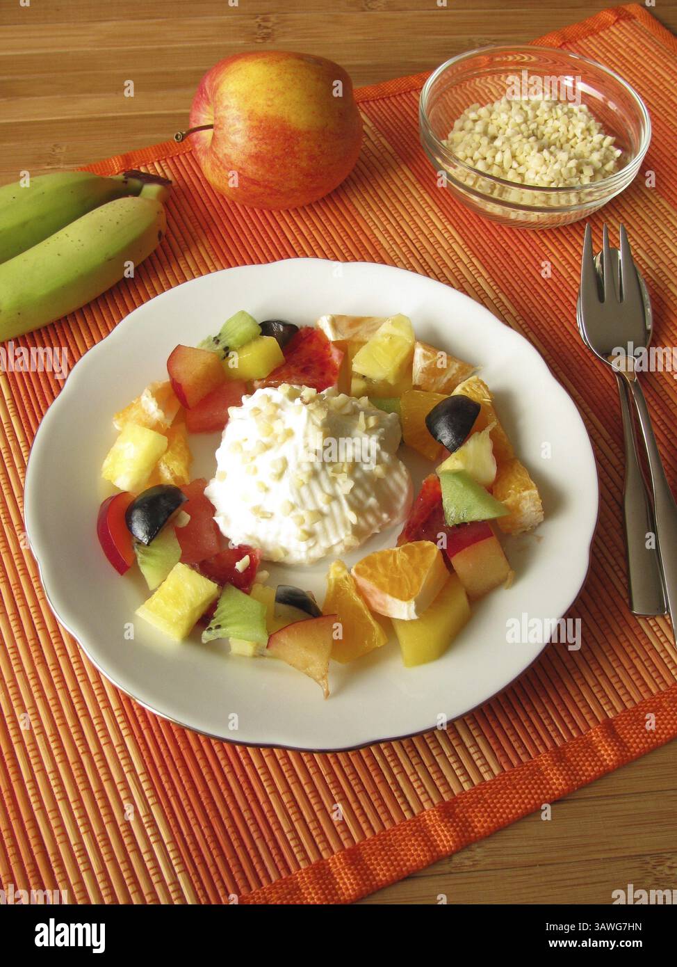 Fruit salad with almond quark Stock Photo - Alamy