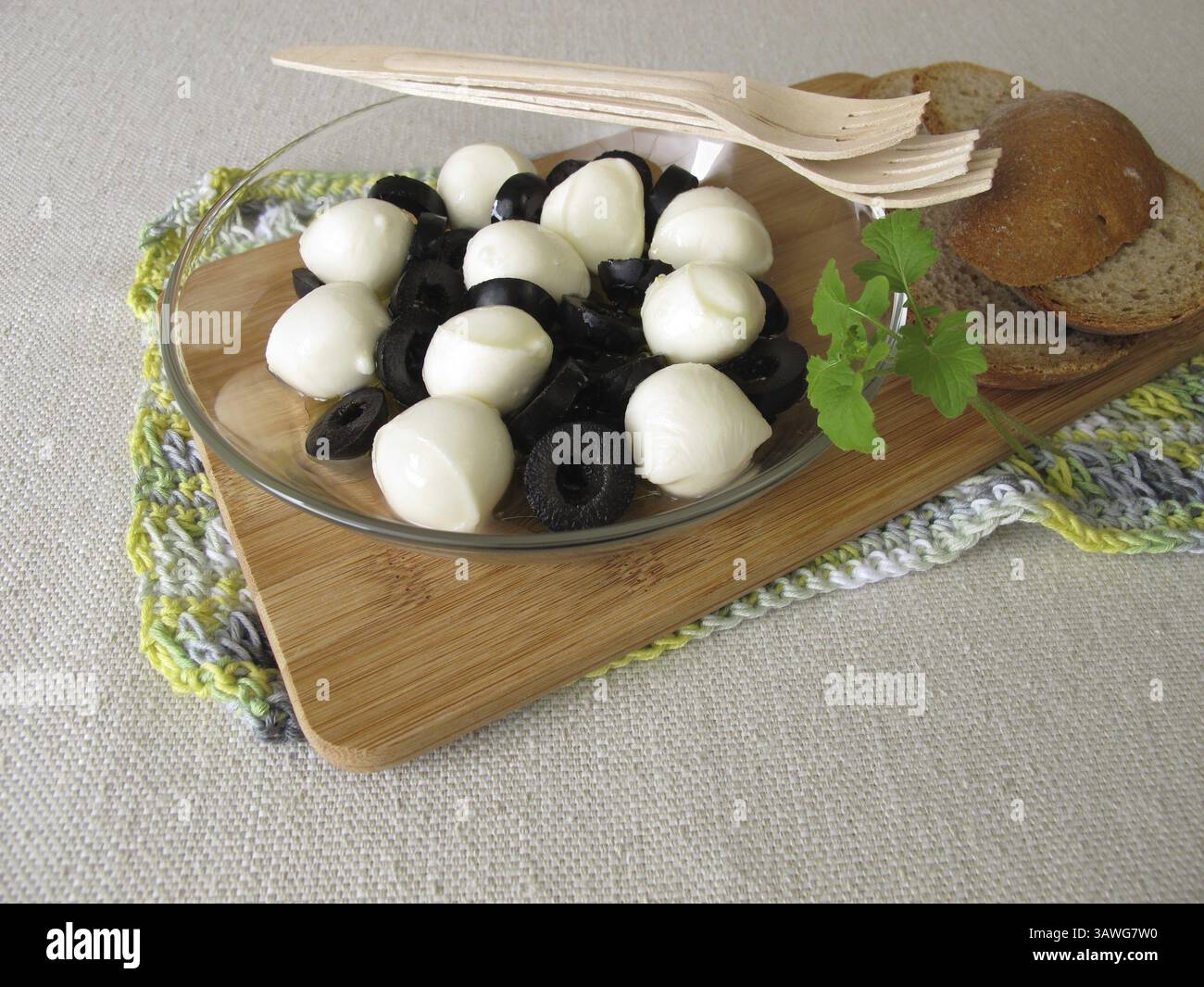 Antipasto with black olives and mozzarella balls in olive oil Stock ...